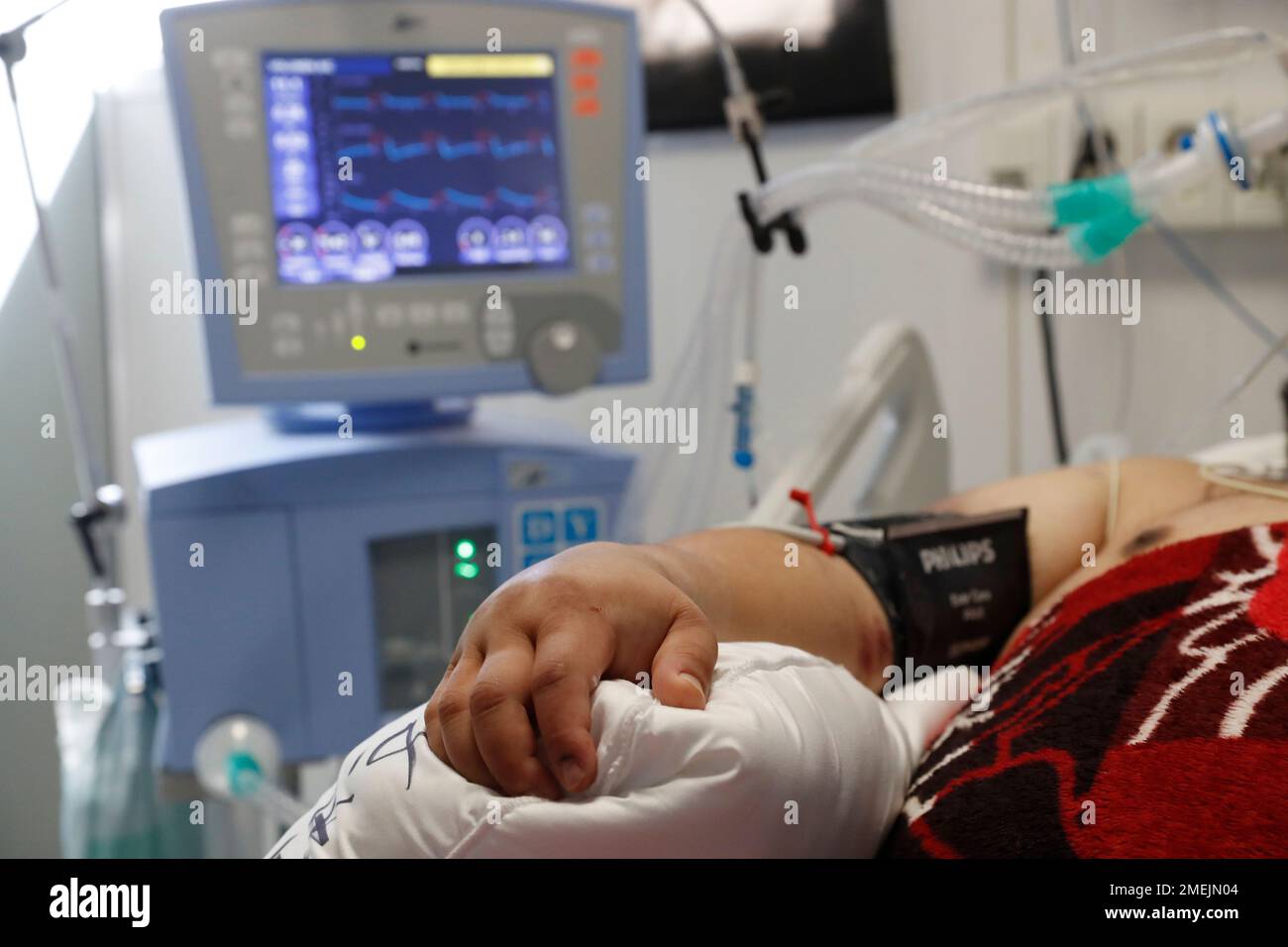 A COVID-19 patient lies in the ICU of the National Hospital in Itaugua ...