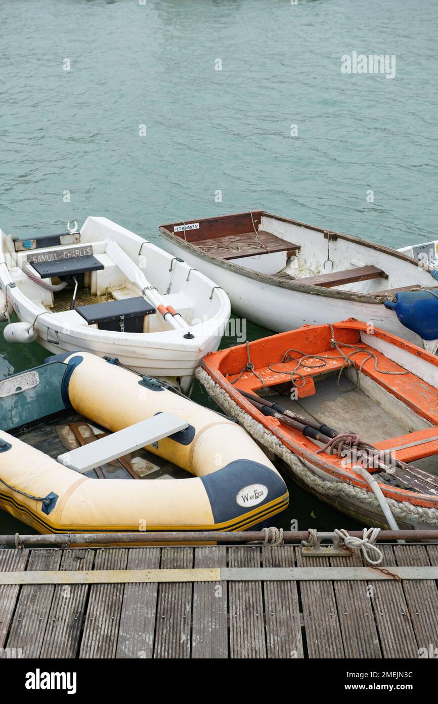 Boat tenders, on water, St Aubins, Jersey, Channel Islands Stock Photo ...