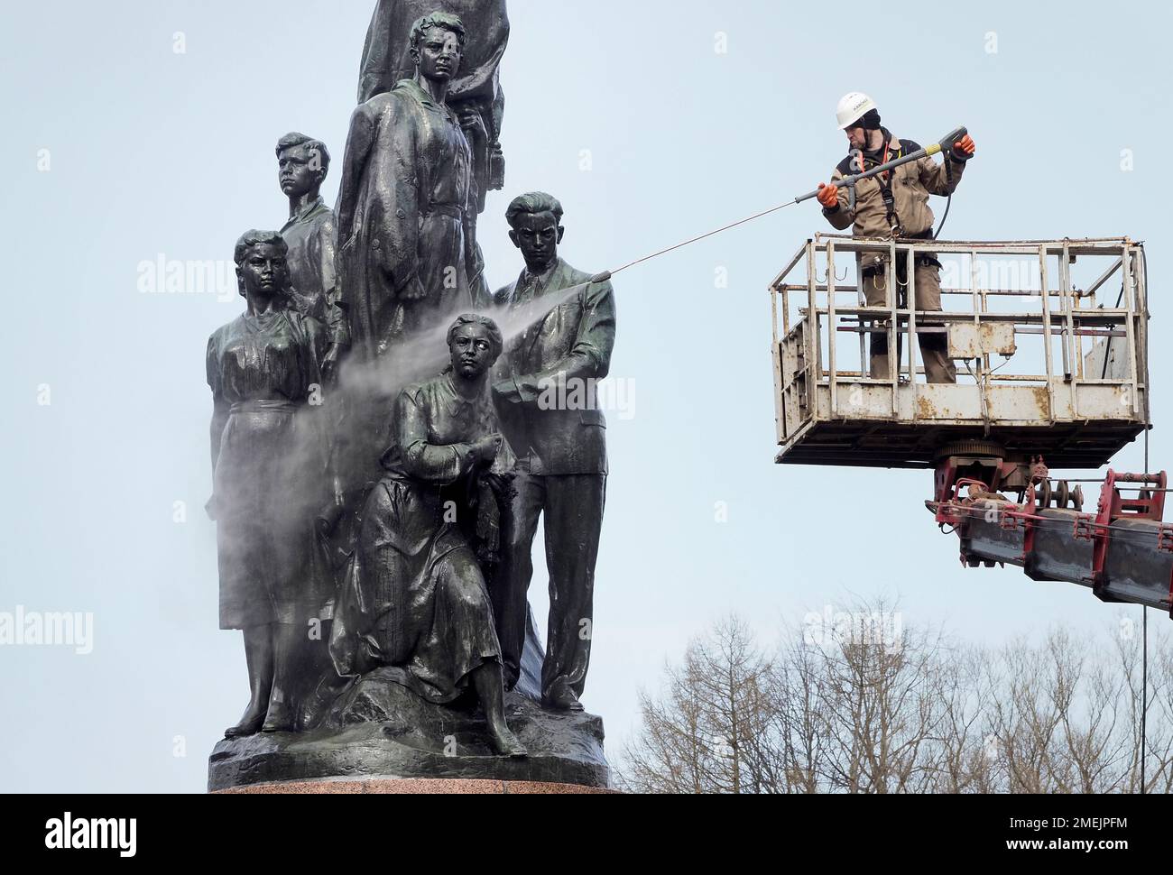 A worker washes a monument for heroes of the town of Krasnodon who died ...