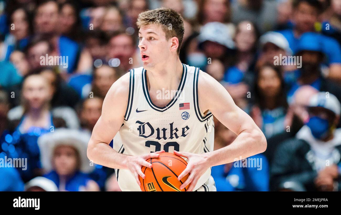 Duke center Kyle Filipowski (30) brings the ball up court against Miami ...