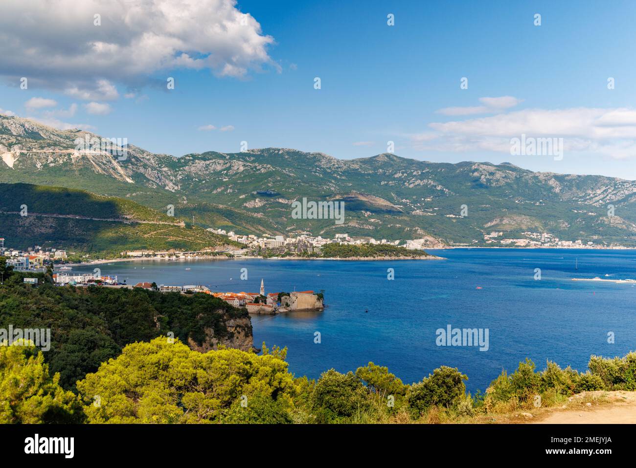Bird's eye view of historical resort towns of Budva and Becici with luxury hotels and ...