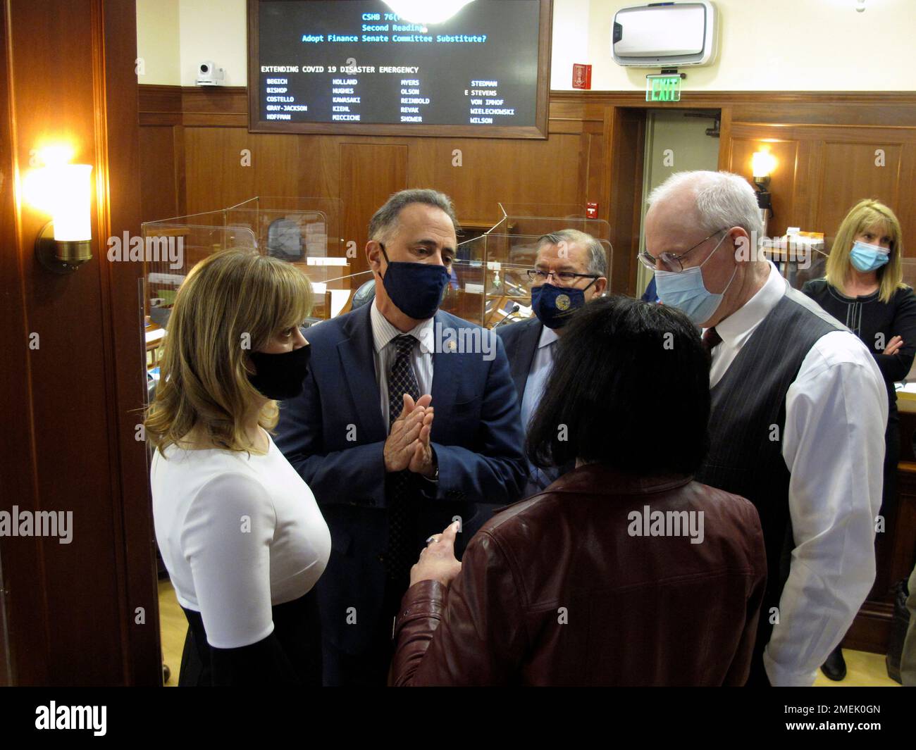 Alaska state Sen. Lora Reinbold speaks to Sen. Roger Holland before the ...