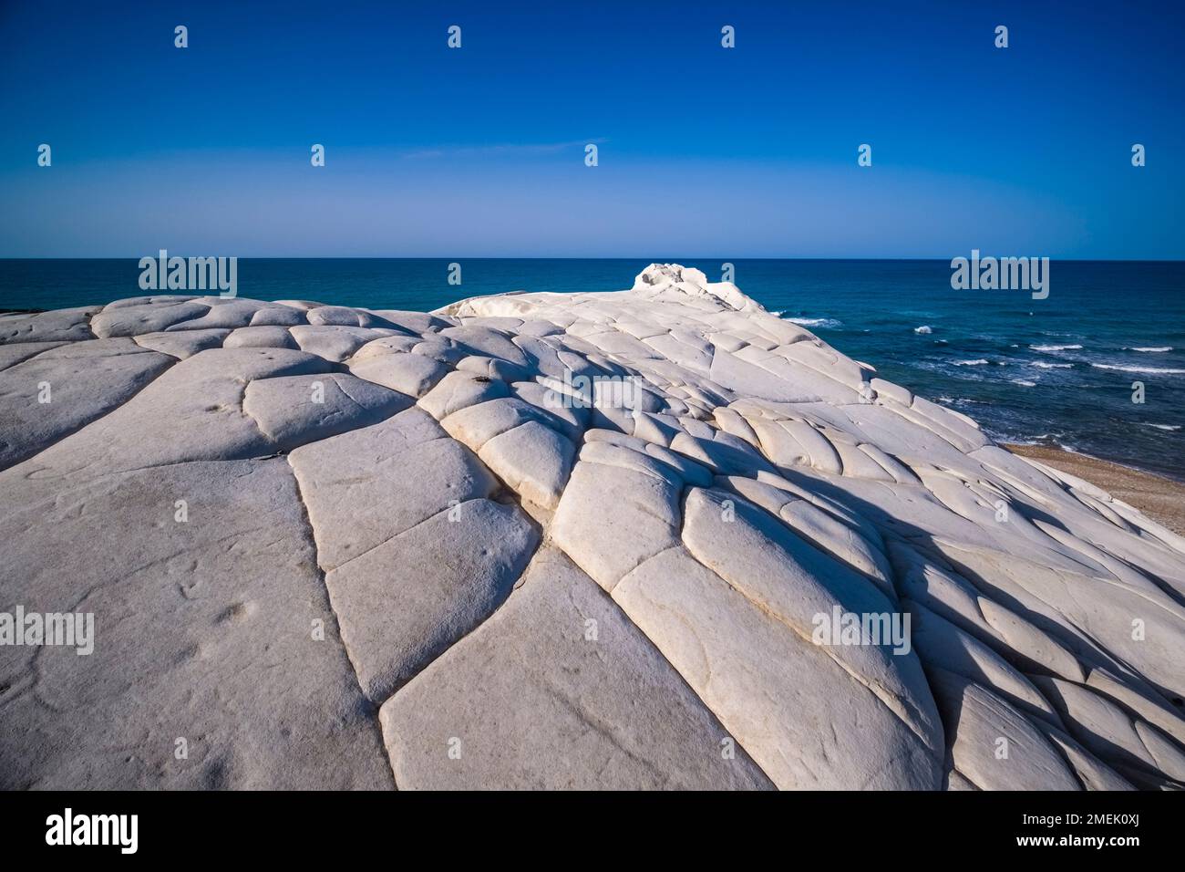 The white rocks of Capo Bianco, the blue water of the sea in the ...