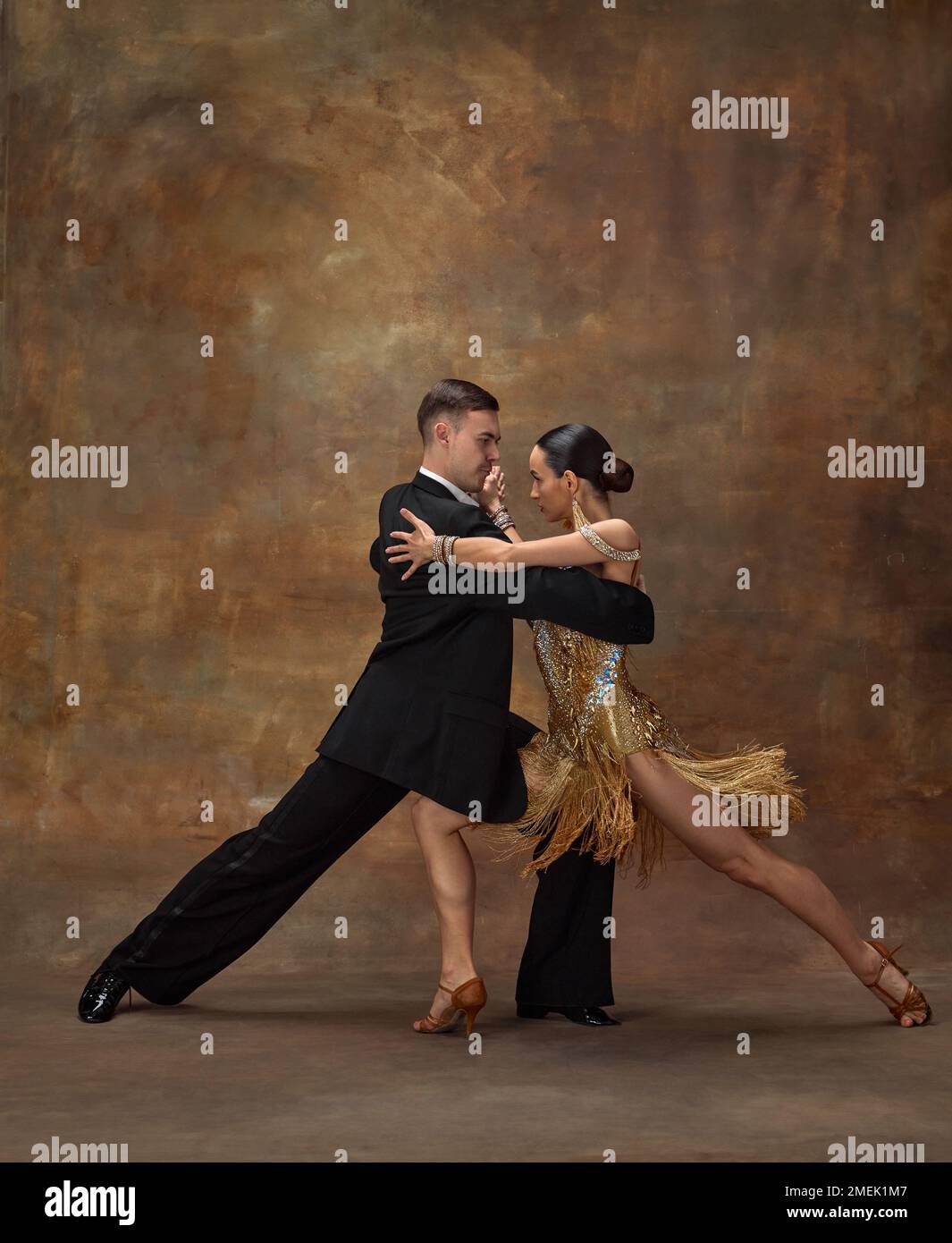 Attraction, passion, emotions. Man and woman, professional dancers in stylish, beautiful stage ...