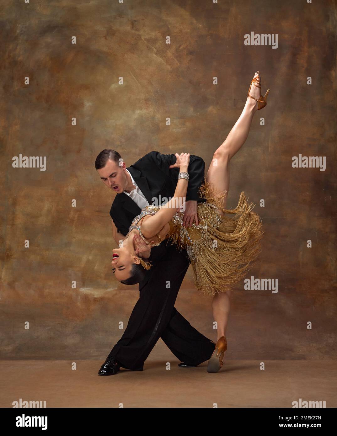 Expressive couple dance. Man and woman, professional dancers in stylish ...