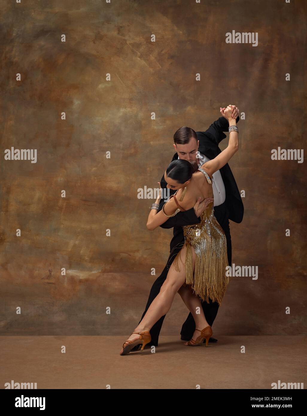 Femininity and masculinity. Man and woman, professional tango dancers in stylish, beautiful ...