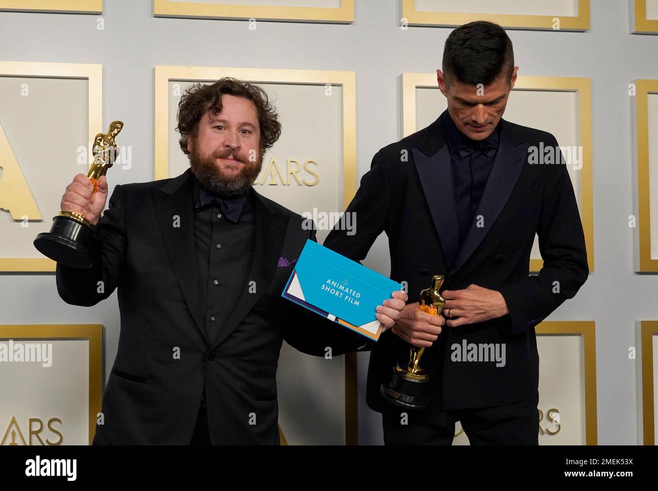 Michael Govier, left, and Will McCormack pose in the press room with ...