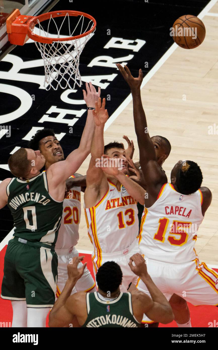 The Atlanta Hawks and the Milwaukee Bucks fight for a rebound during ...