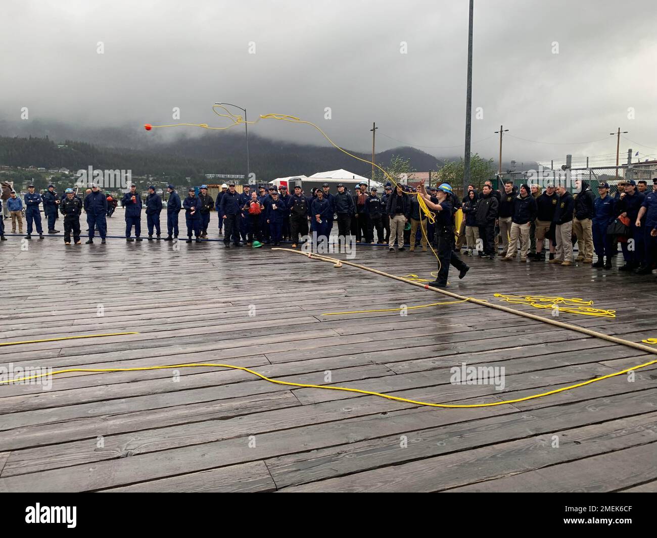 Crewmembers tossing a throwing line during the Buoy Tender Olympics at ...
