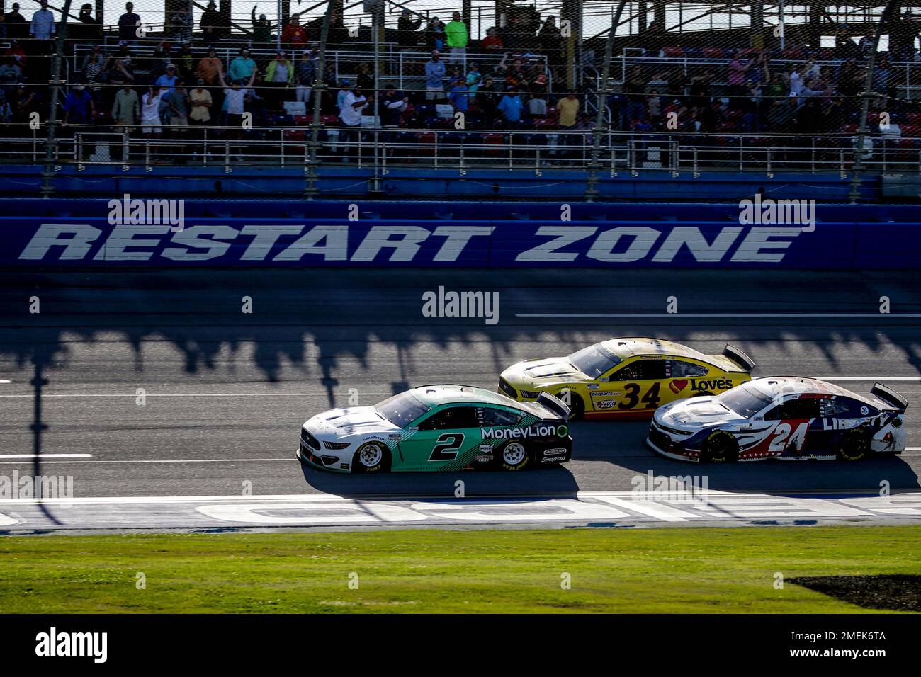 NASCAR Cup Series driver Brad Keselowski (2) leads the way to the ...