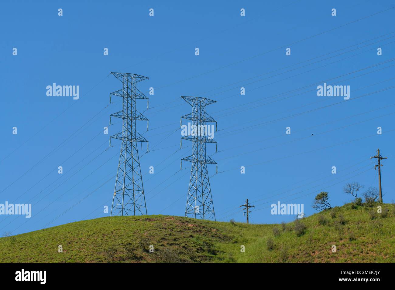 Electric power transmission tower in rural area with blue sky ...