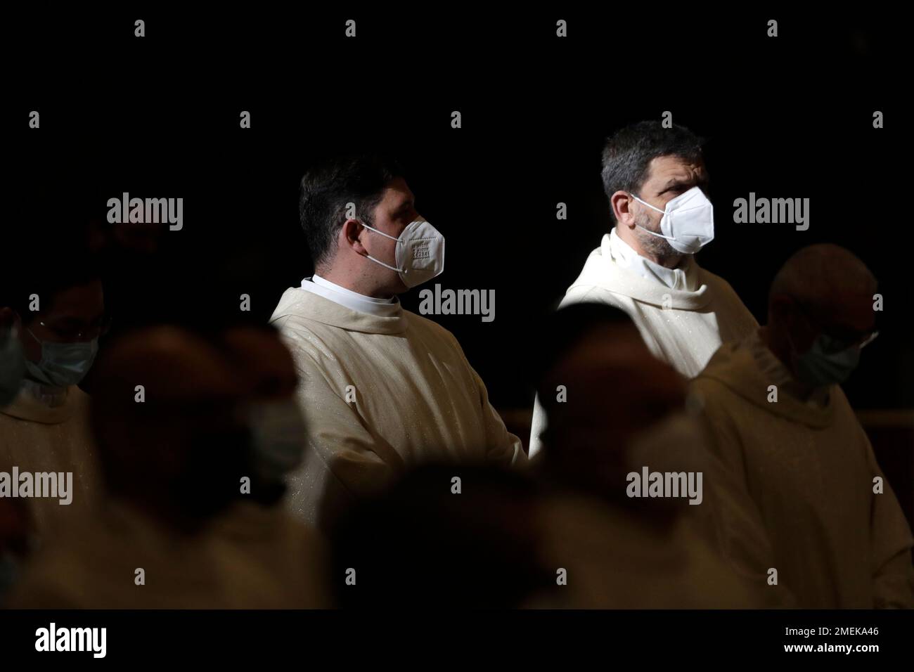 Priests wear face masks to curb the spread of COVID-19 as they attend a ...
