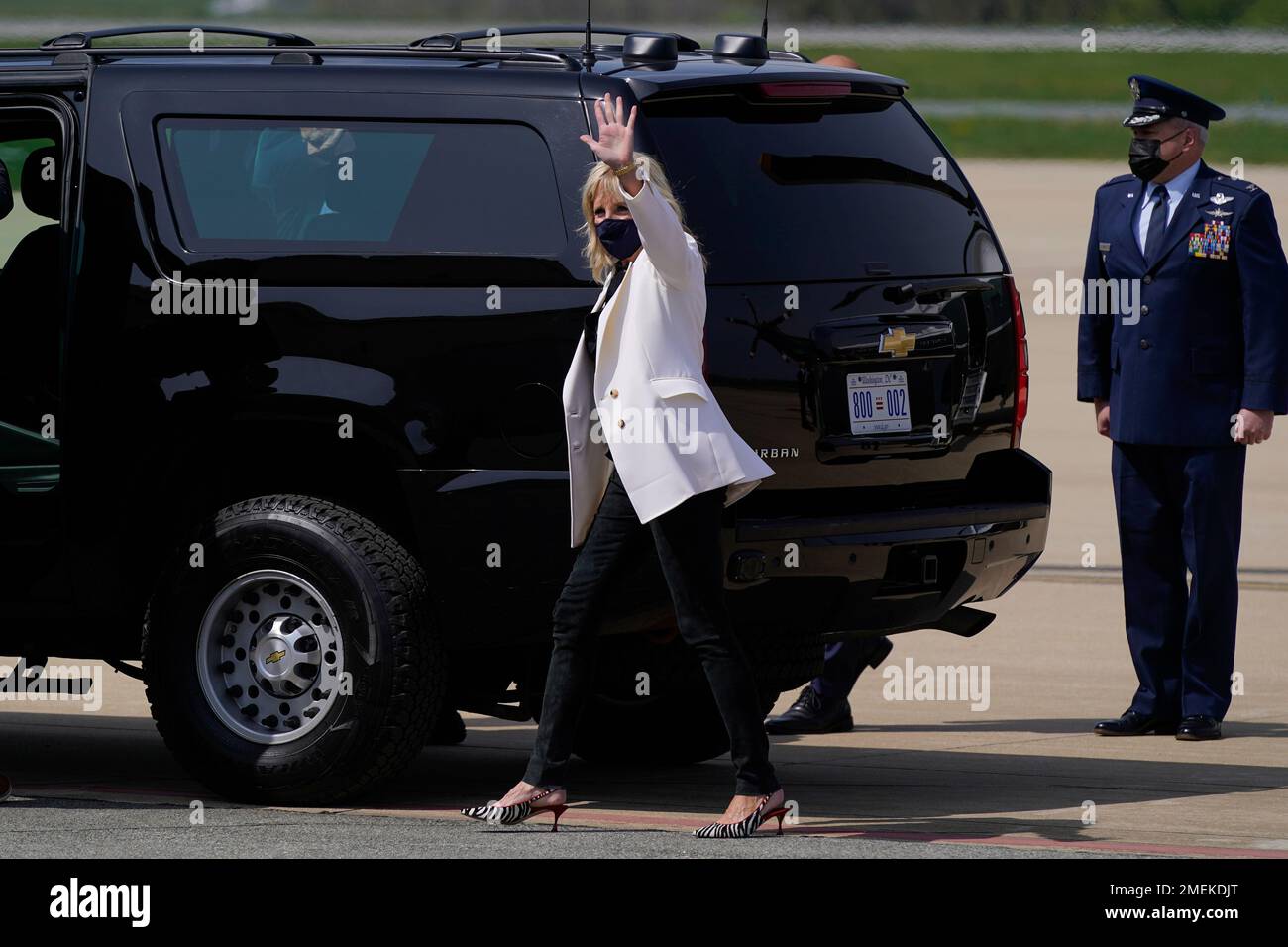 First lady Jill Biden waves as she walks to a motorcade vehicle after ...