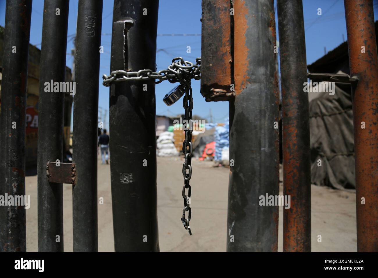 A lock hangs on a gate to a market area during a voluntary weekend ...