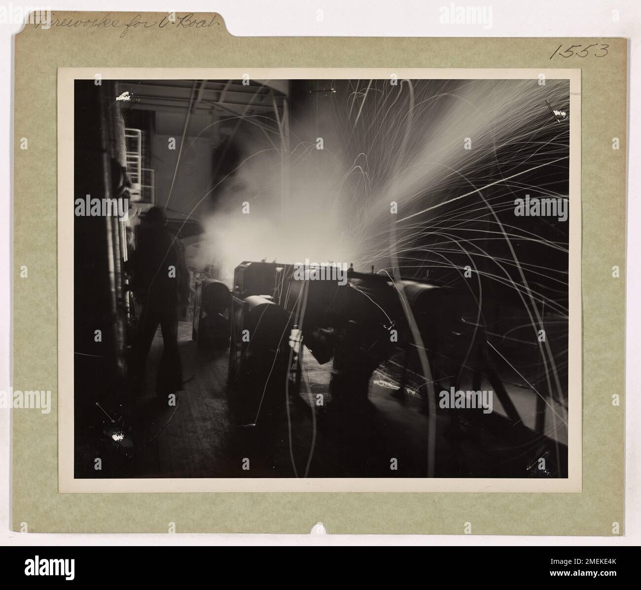 U.S. Coast Guardsmen witness a spectacular fireworks display as they ...