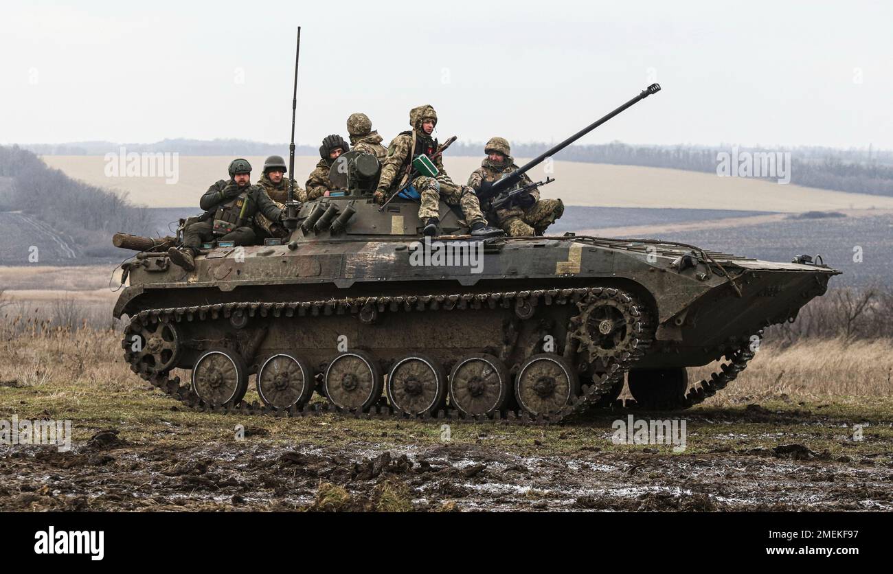Ukrainian soldiers sit on top of an APC during combat training in ...