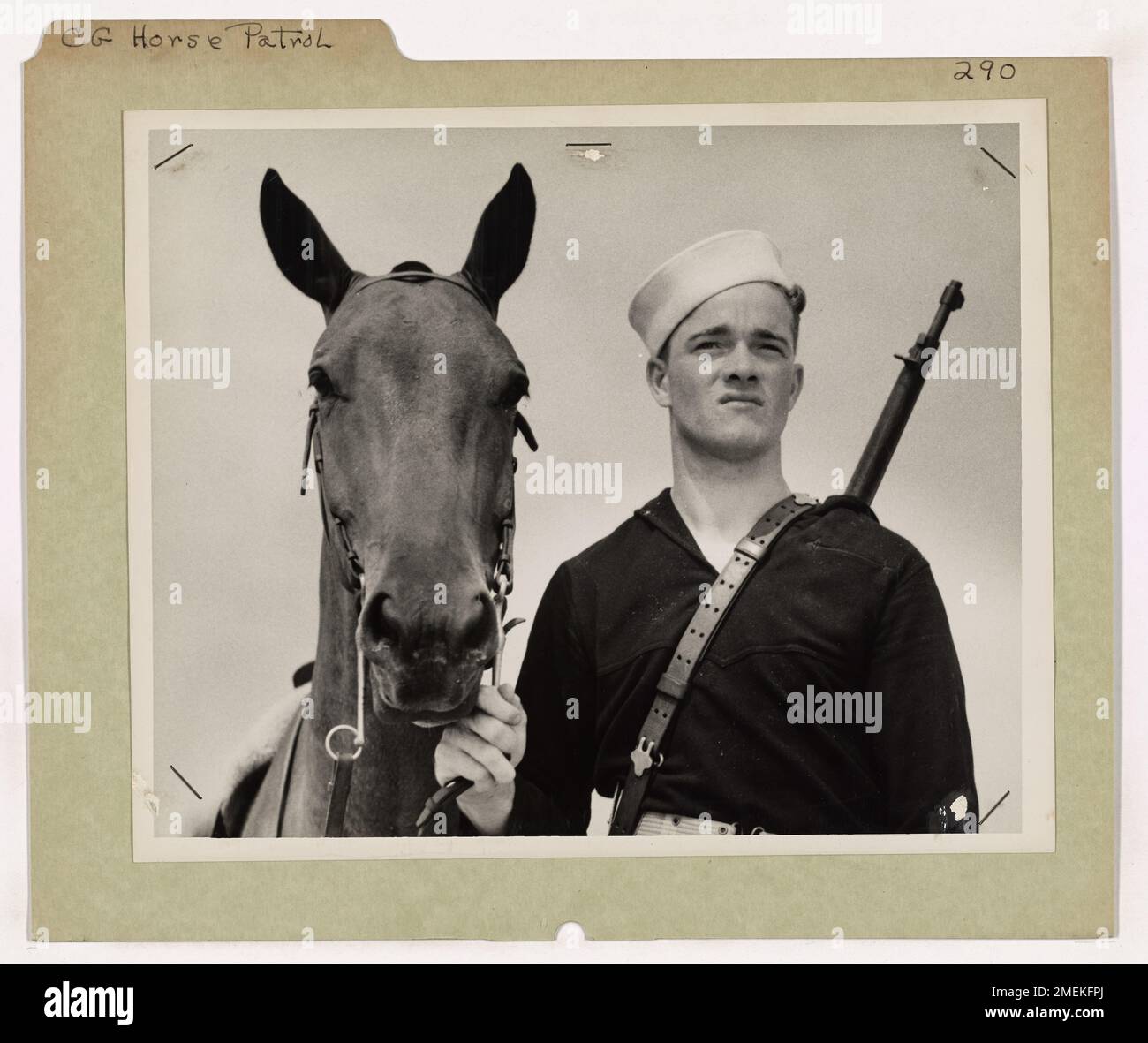 This photograph shows a Coast Guardsman on horseback patrolling the ...