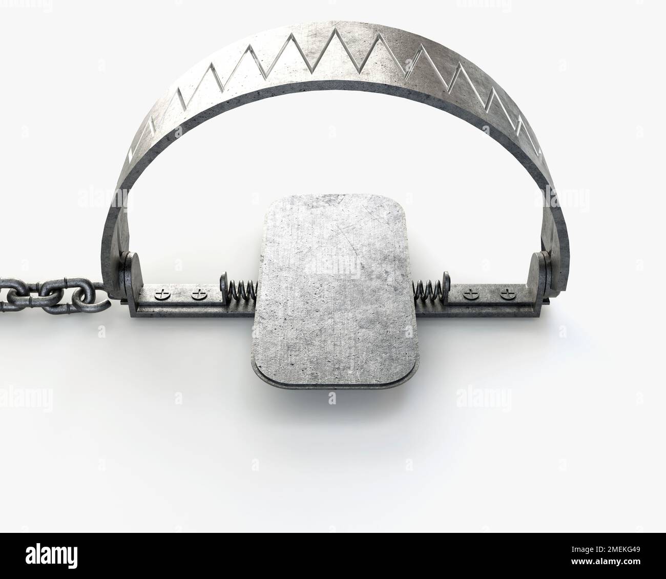 A shut metal animal hunting trap attached to the ground with a metal ...