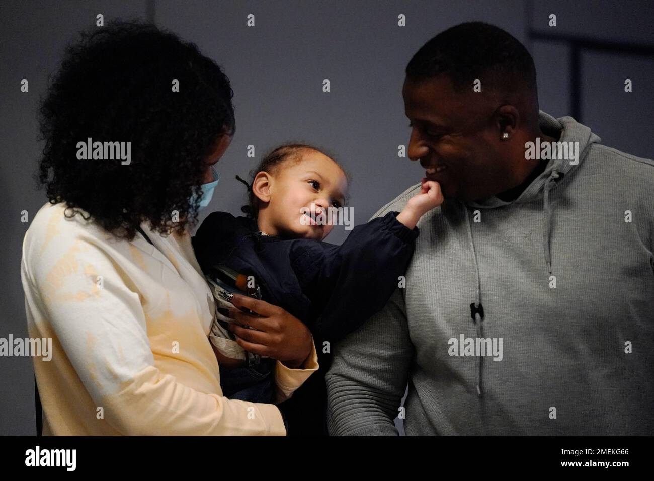 Daunte Wright Jr., center, son of Daunte Wright, reaches to touch his ...