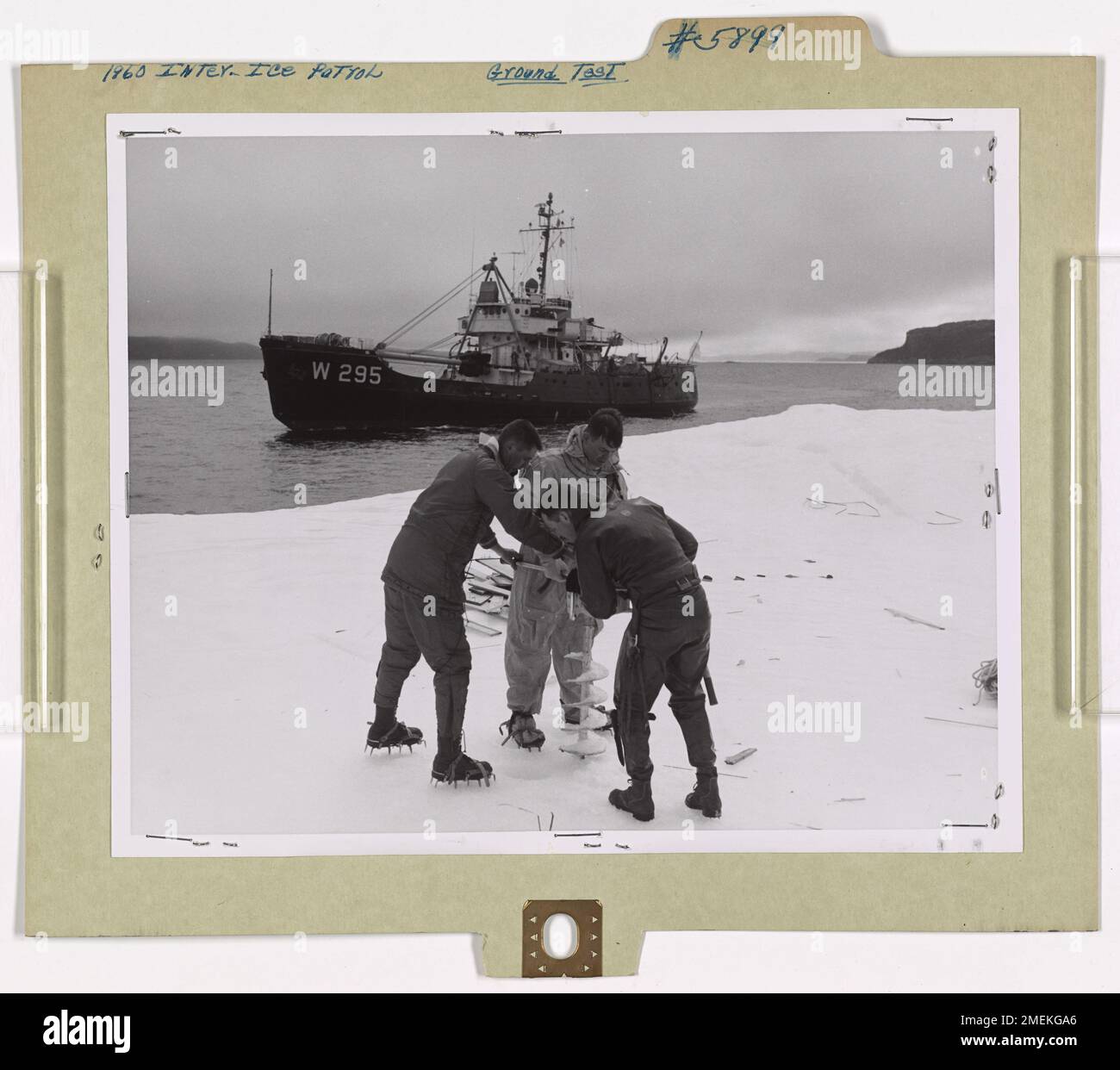 Ice Patrol personnel mine a tabular iceberg in Cape Bonavista Bay ...