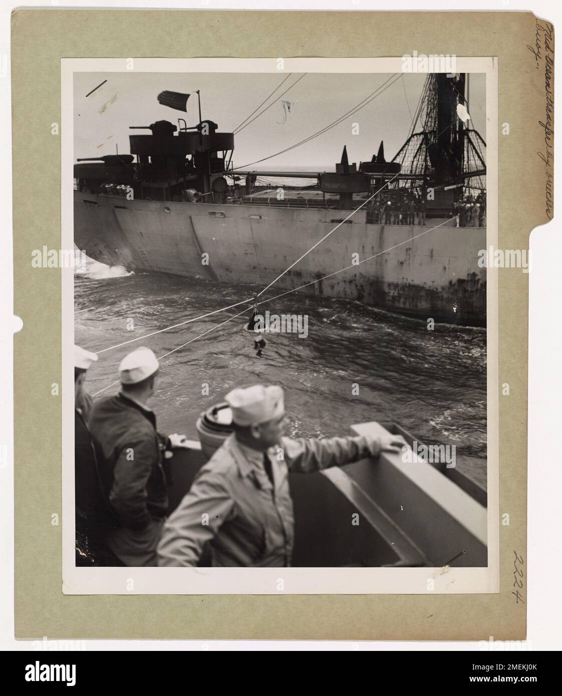 Mid-Ocean Transfer by Breeches Buoy. Over the chasm between two ships ...