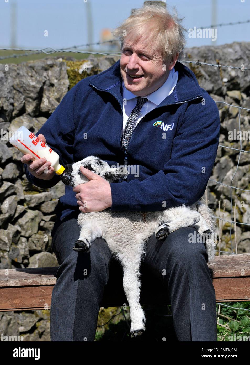 Britain's Prime Minister Boris Johnson feeds a lamb at Moor Farm in ...