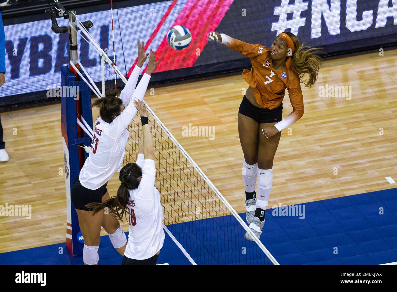 Texas' Asjia O'Neal (7) spikes the ball against Wisconsin's Molly ...