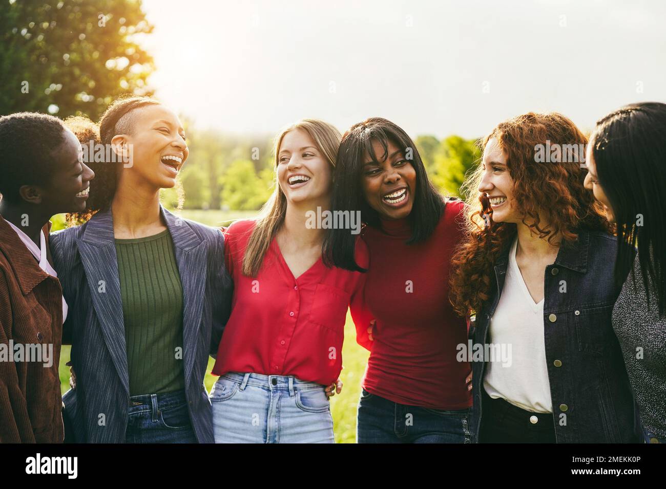 Multiracial Female Friends Having Fun Hugging Together Outdoor Focus