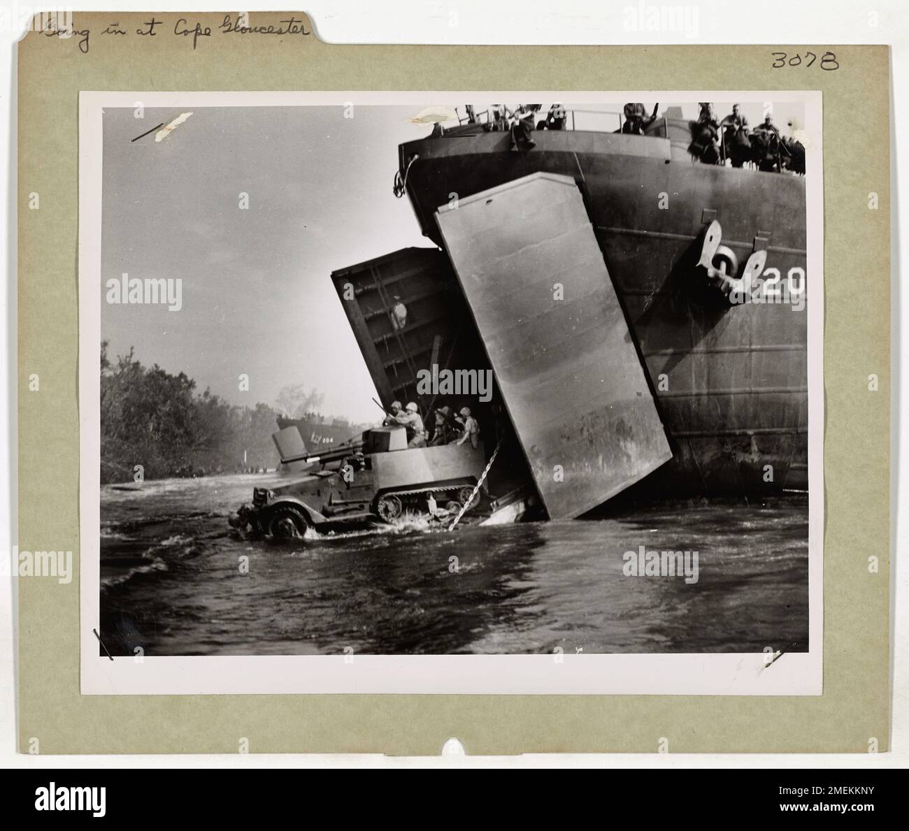 A Coast Guard-manned LST (Landing Ship, Tank) releases a half-track ...