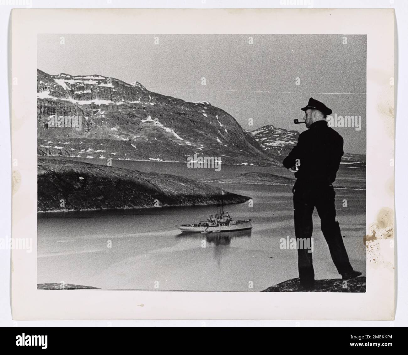 Junior Grade Lieutenant George R. Boyce surveys the Arctic landscape ...
