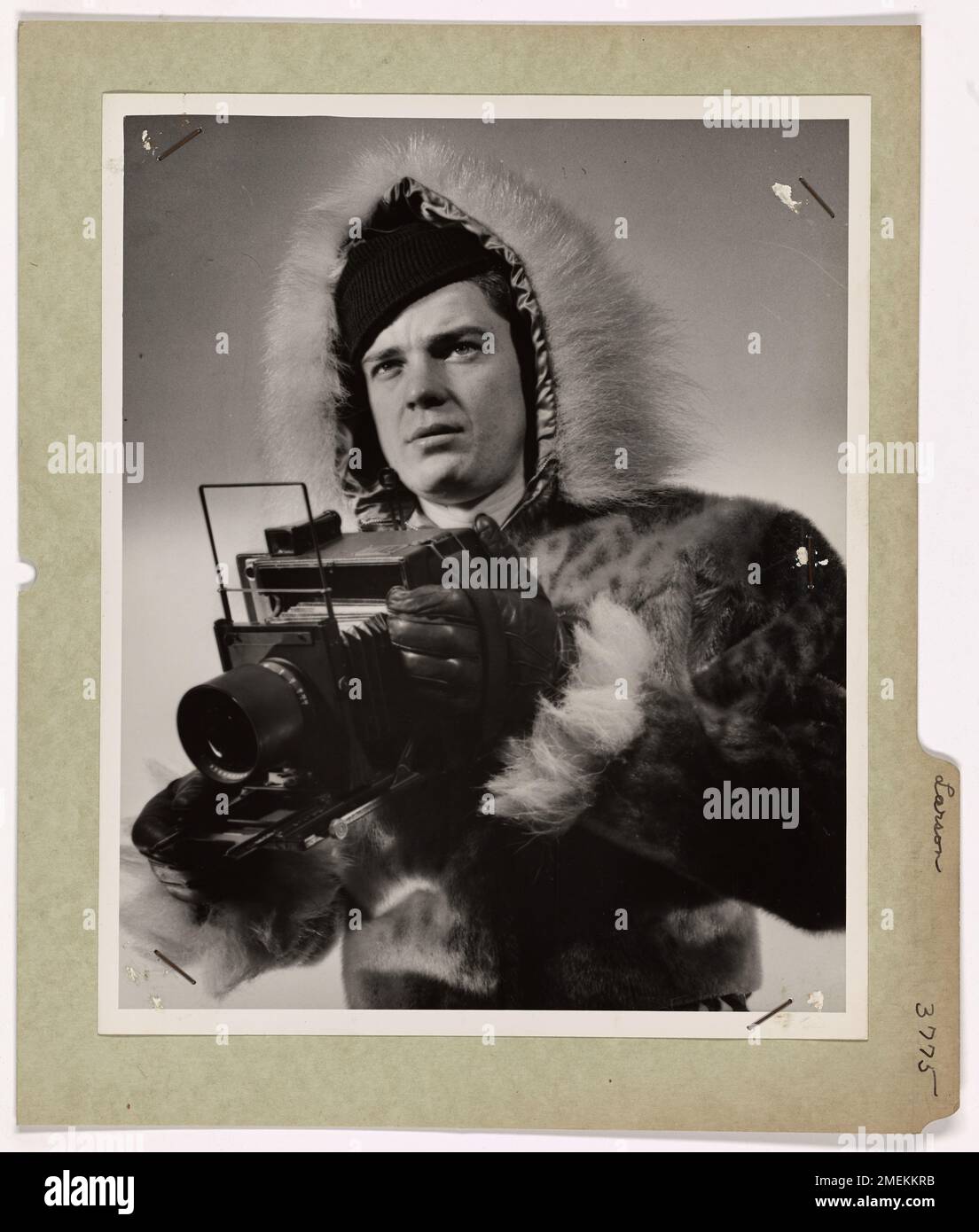 Coast Guardsman Clarence J. Larson, a Photographer's Mate Second Class ...