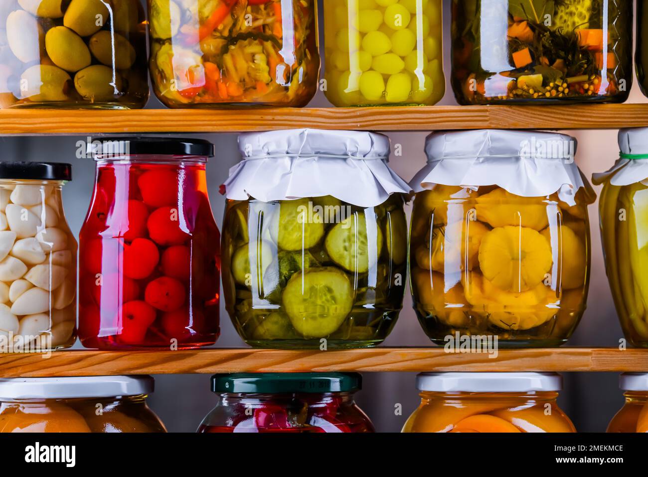 Jars with variety of marinated vegetables and fruits. Preserved food ...