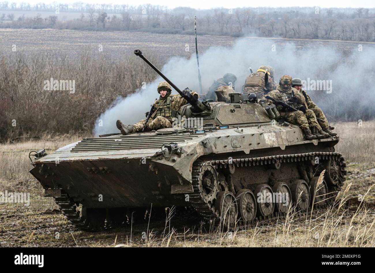 Ukrainian soldiers sit on top of an APC during combat training in ...