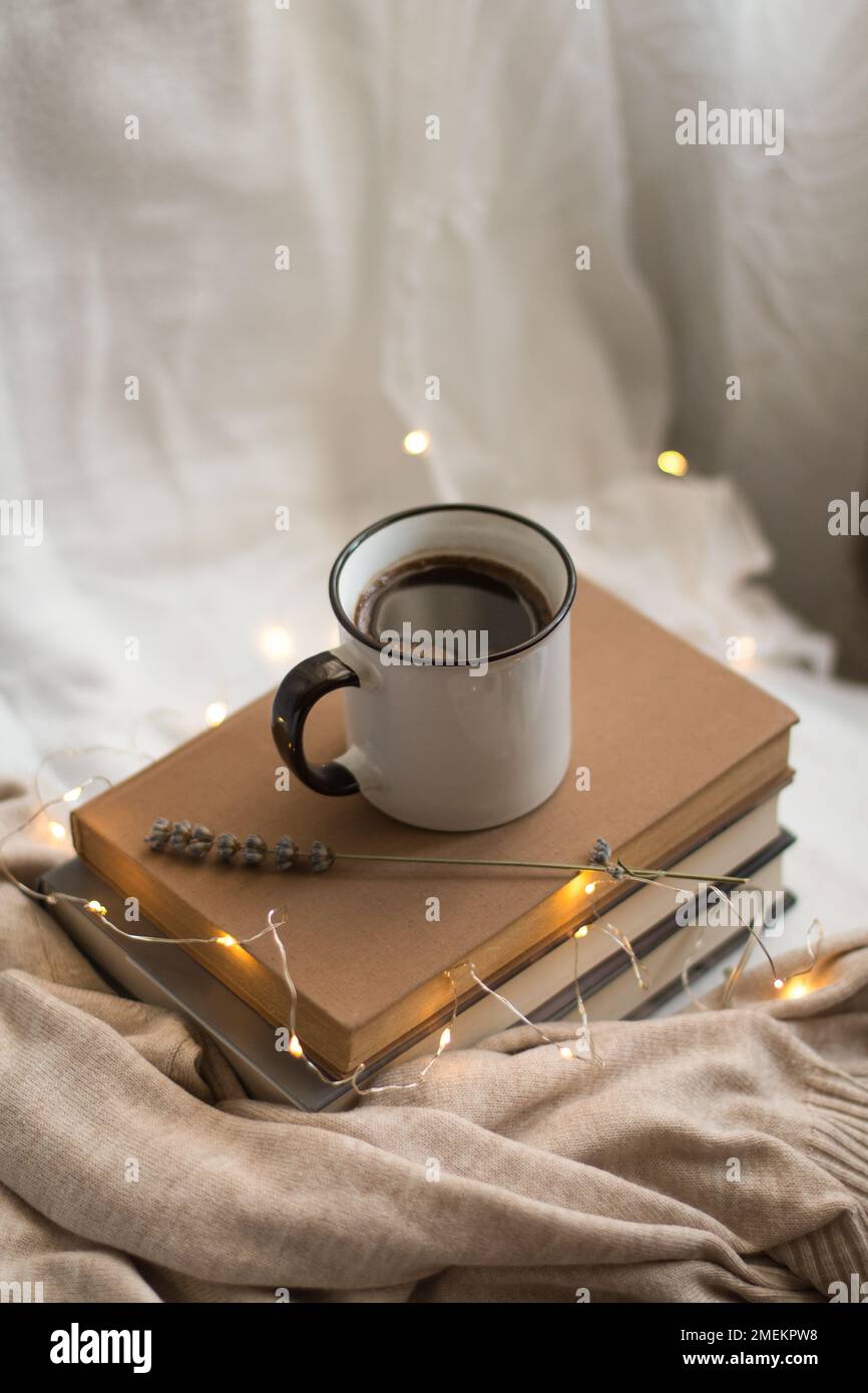 Cozy indoor composition of a cup of coffee, books, lavender for ideal ...