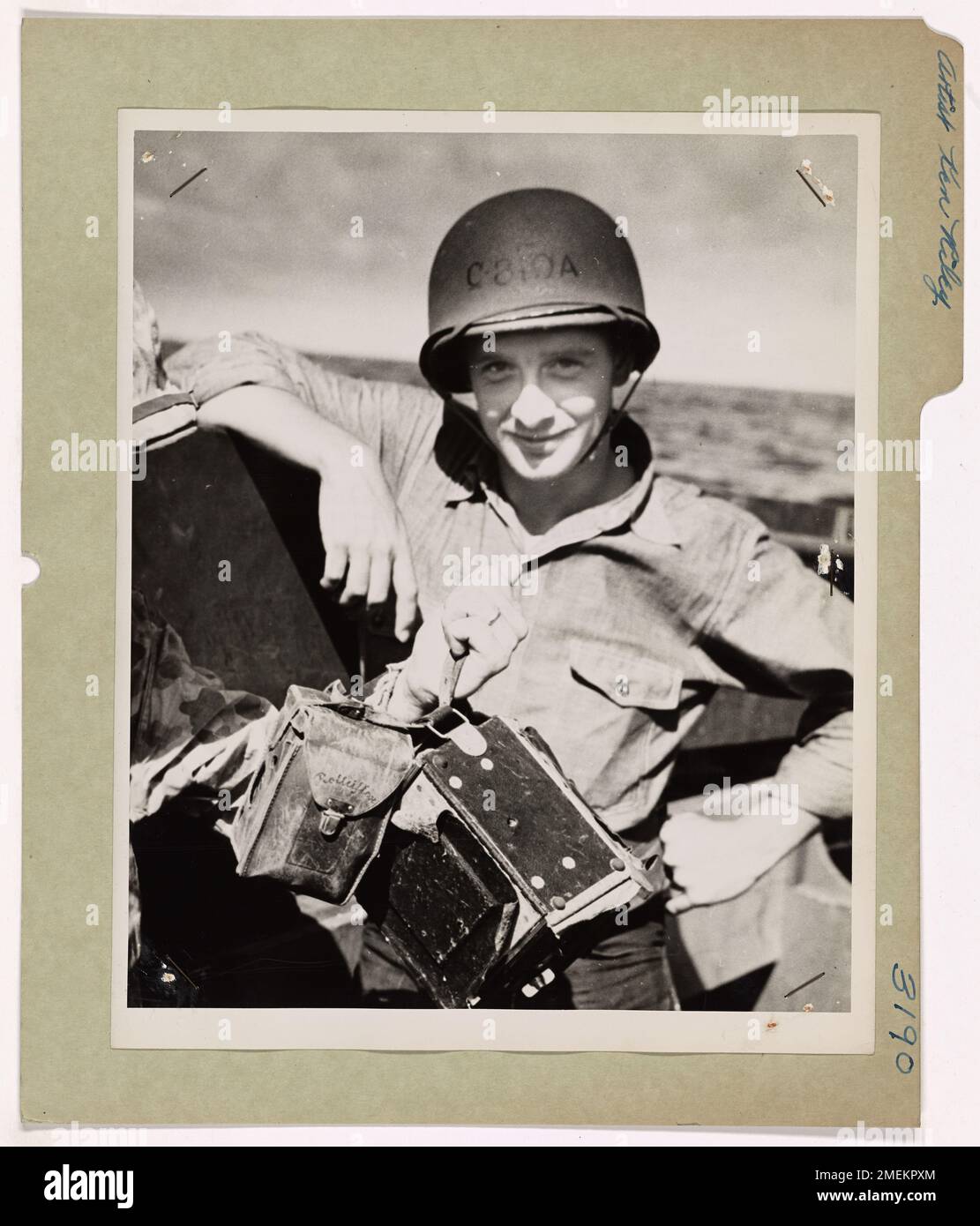 Ken Riley, a Coast Guard combat artist, is pictured aboard a landing ...