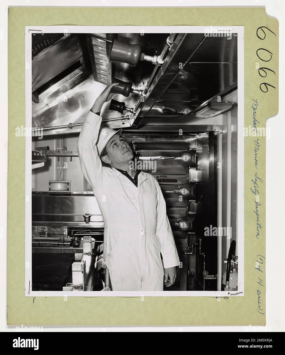 Lieutenant Joel D. Sipas observes the installation of a CO2 fire ...