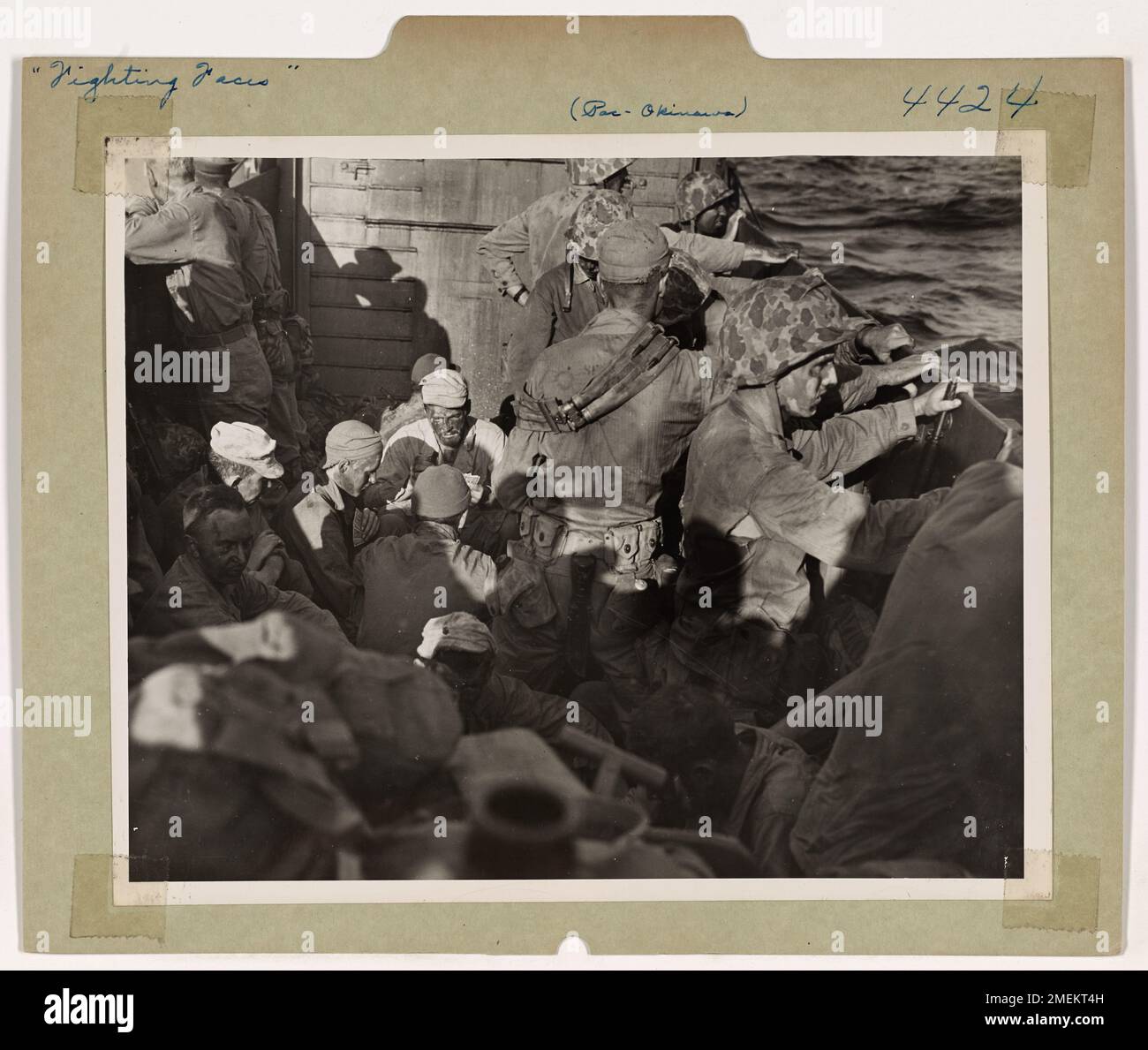 A Coast Guard-manned landing boat approaches the beach at Okinawa, with ...