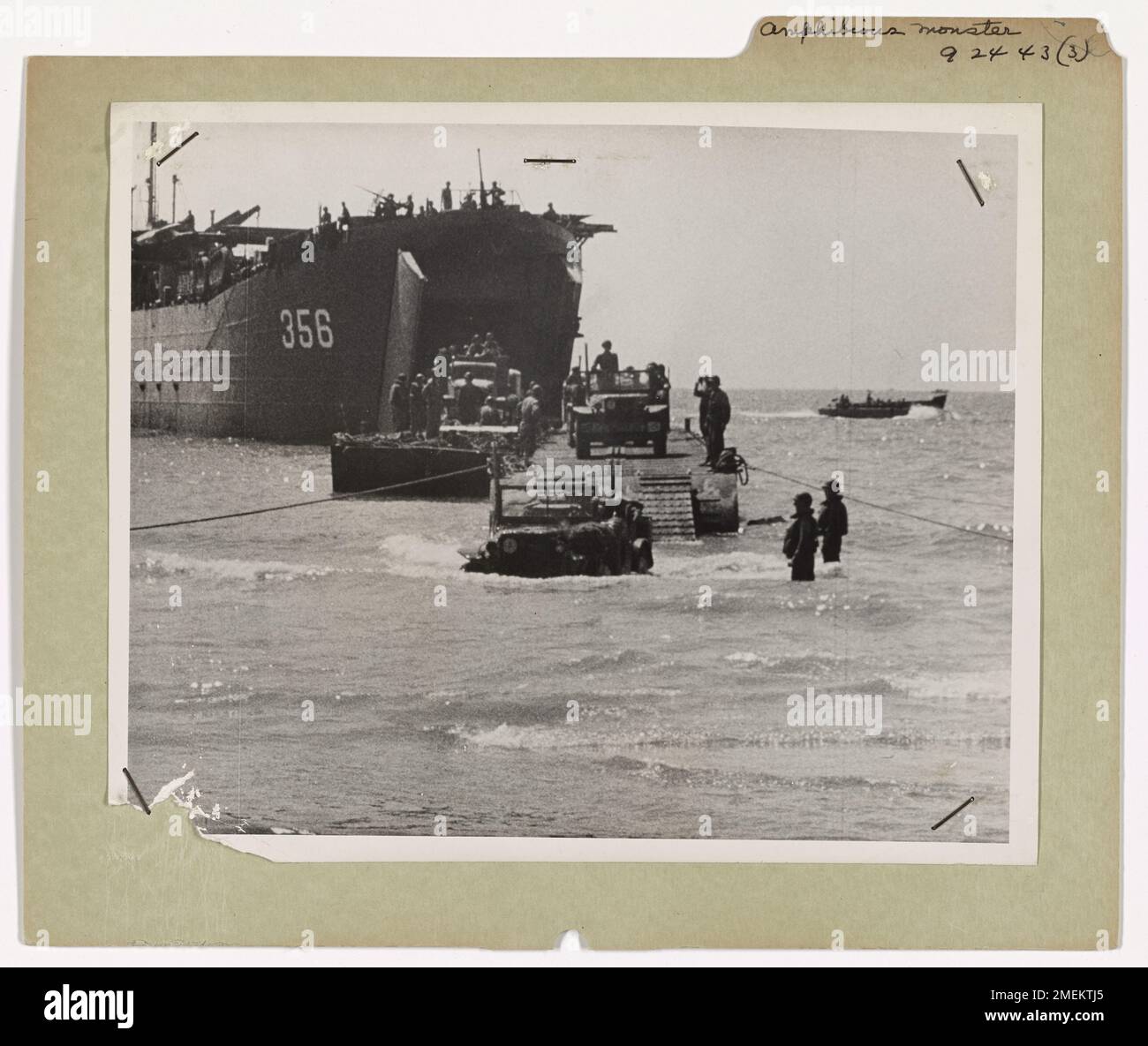 A Coast Guard photo shows an LST (Landing Ship, Tank) unloading heavy ...