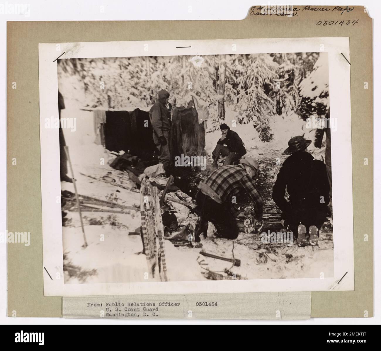 Coast Guardsmen in Alaska build a sled to move an injured plane crash ...
