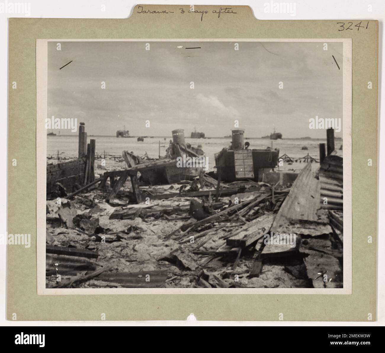 Three days after the invasion of Tarawa, the beach is littered with ...