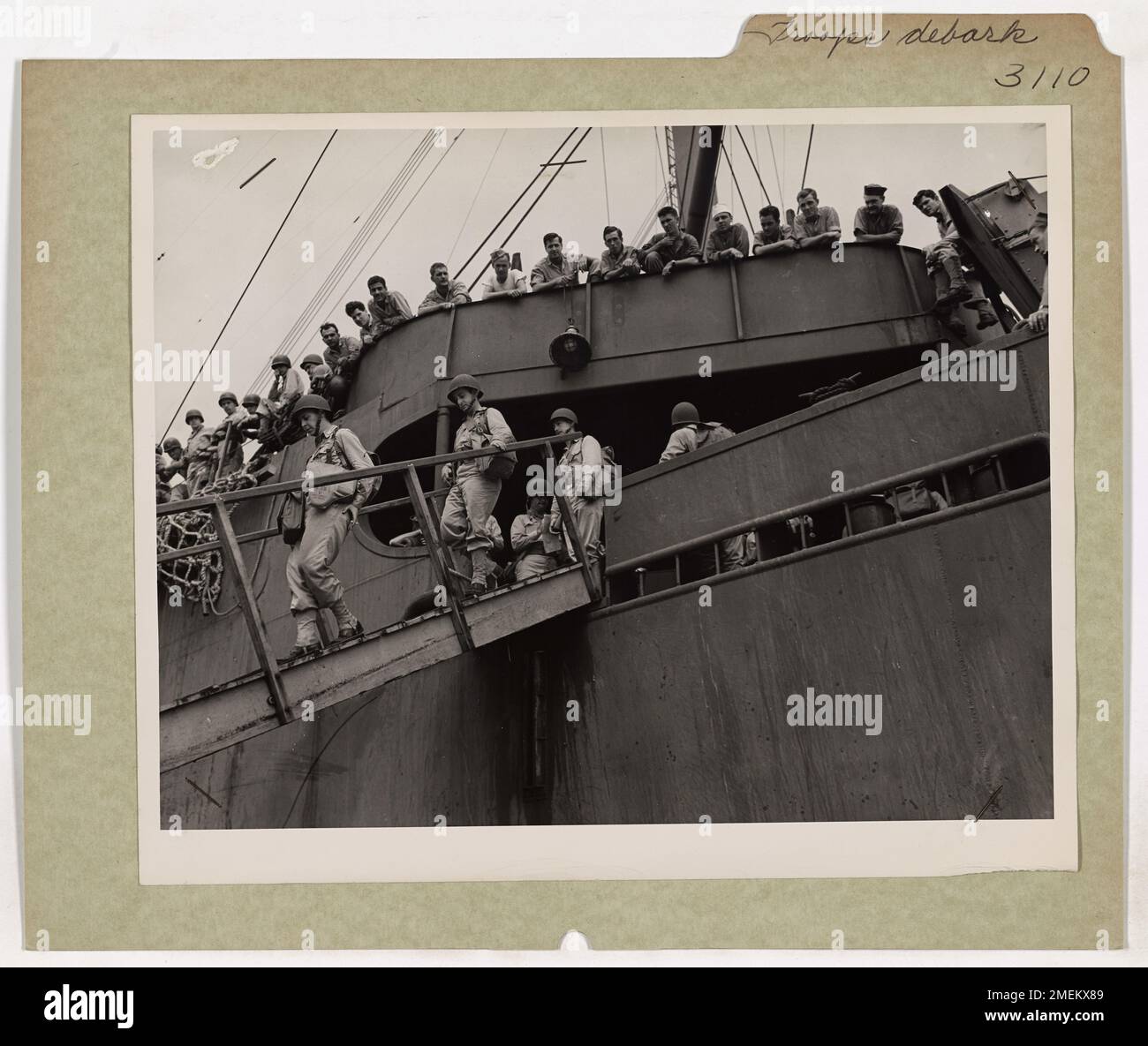 A Coast Guard-manned transport ship arrives at a British Isle in the ...