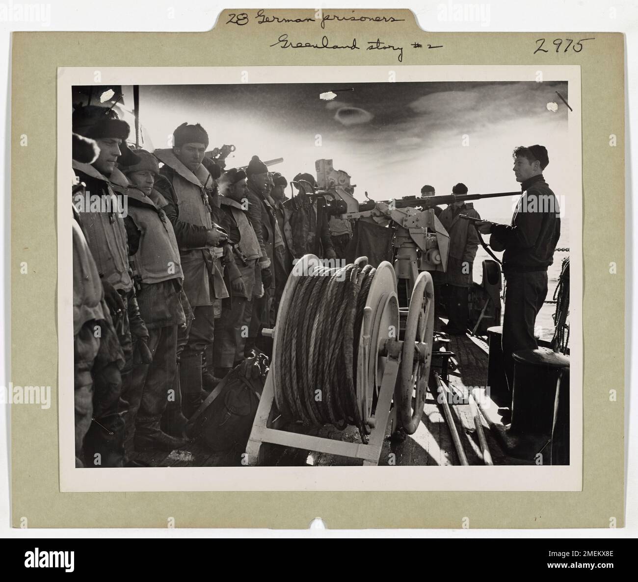 This image shows 28 German prisoners aboard a Coast Guard combat cutter ...