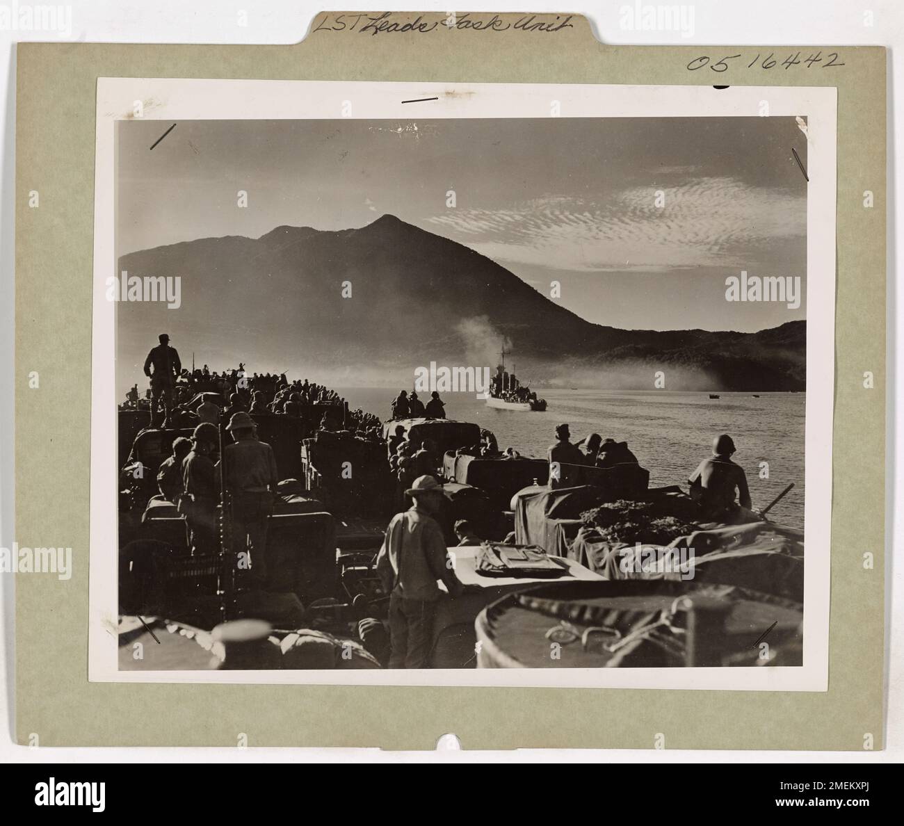 This image shows a Landing Ship Tank (LST) leading a task unit into ...