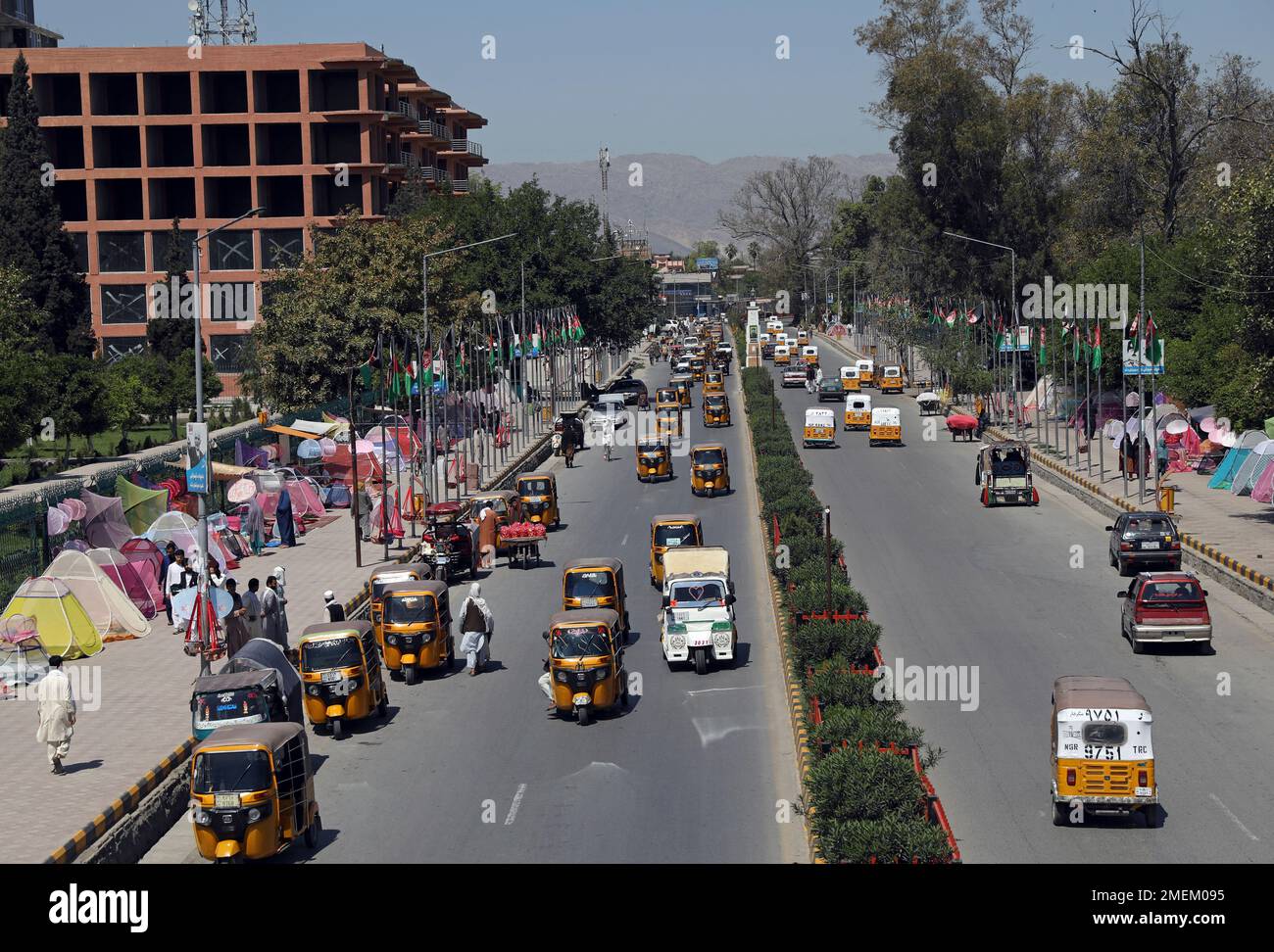 People drive auto rickshaw taxis in the city of Jalalabad east of Kabul ...