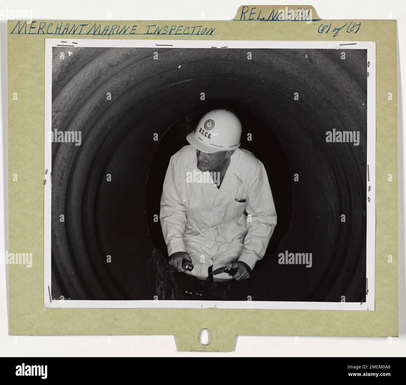 A Coast Guard inspector checks the boiler of the City of Norfolk for ...