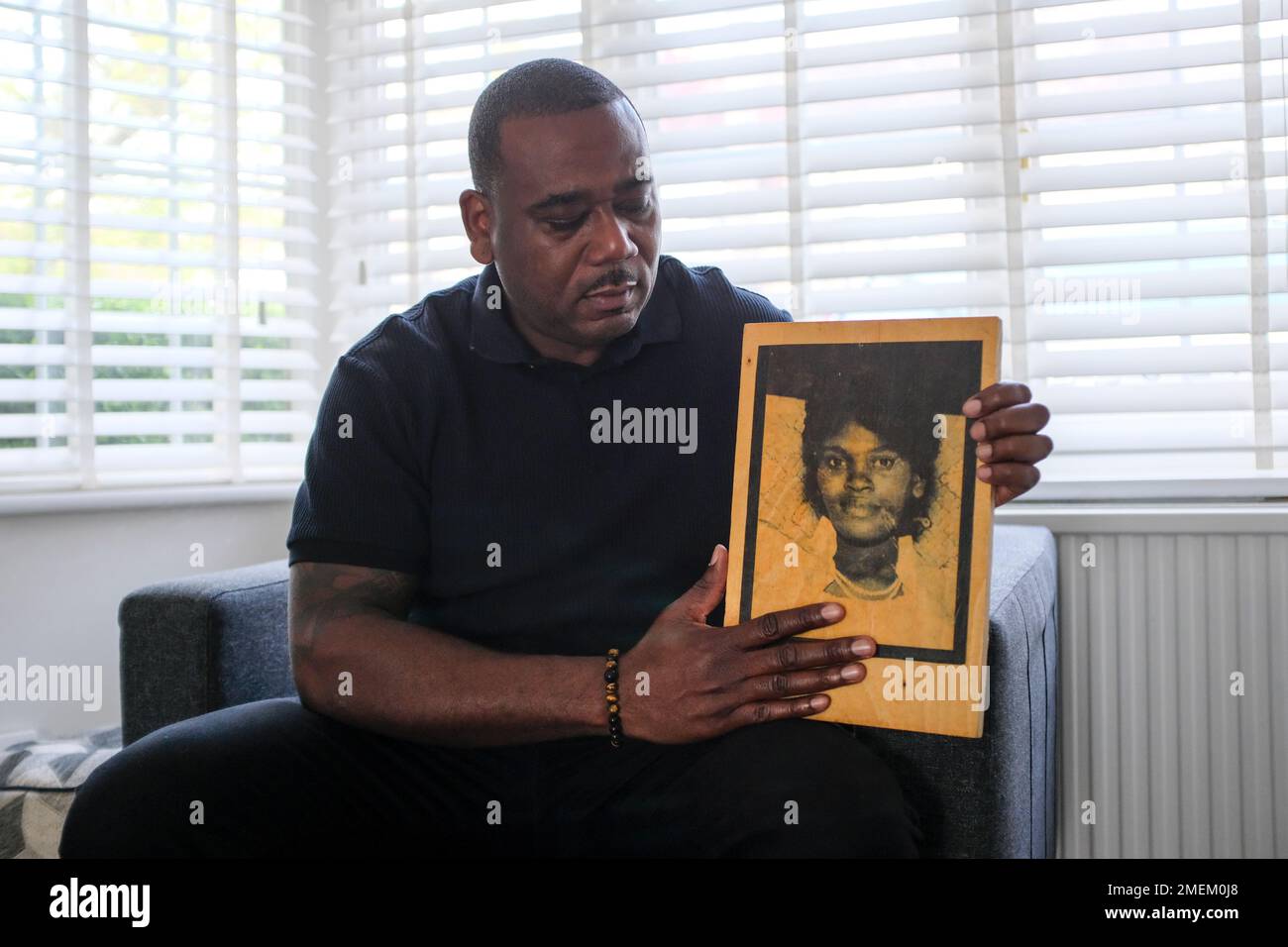 Lee Lawrence poses with a picture of his mother, Cherry Groce, in ...