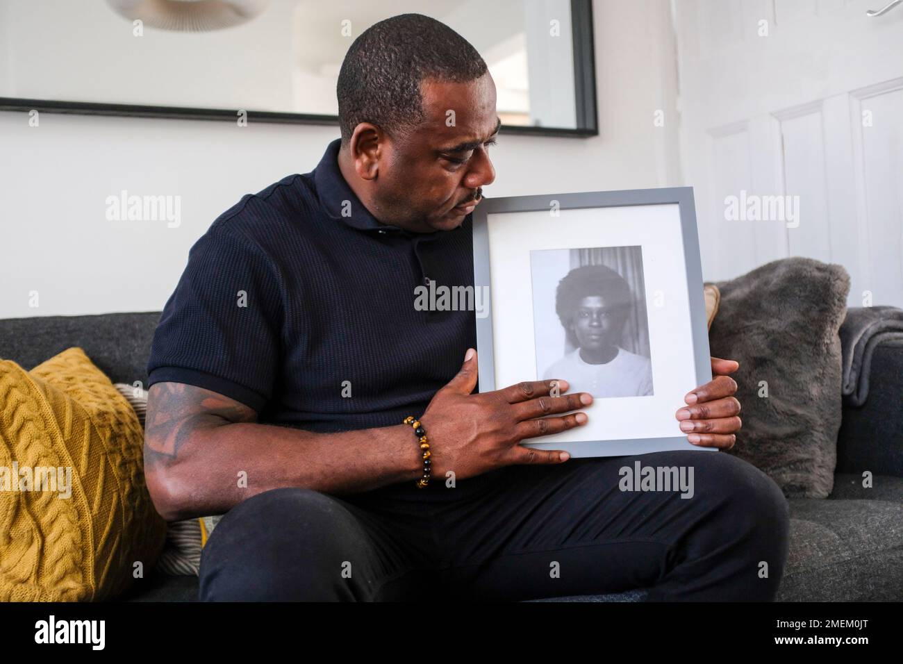 Lee Lawrence poses with a picture of his mother, Cherry Groce, in ...