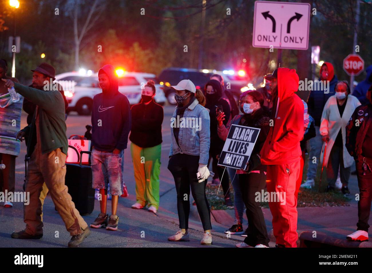 A crowd gathers to protest in the neighborhood where a Columbus police ...