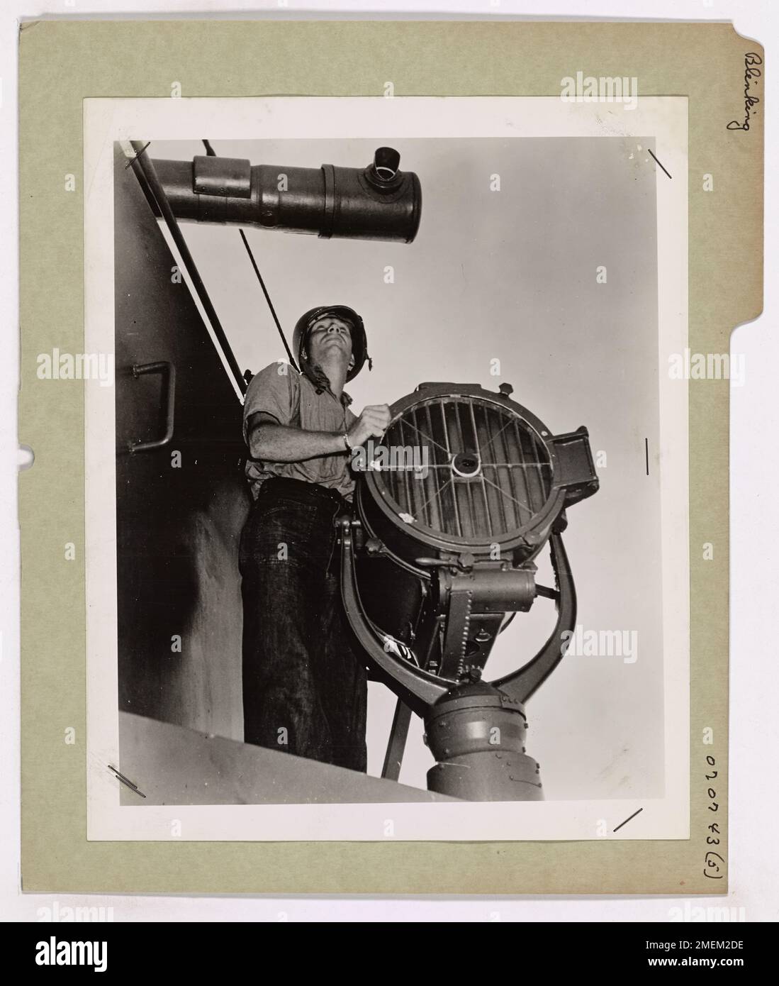 Coast Guard Signalman Aboard a Coast Guard Convoy Cutter Flashes the ...