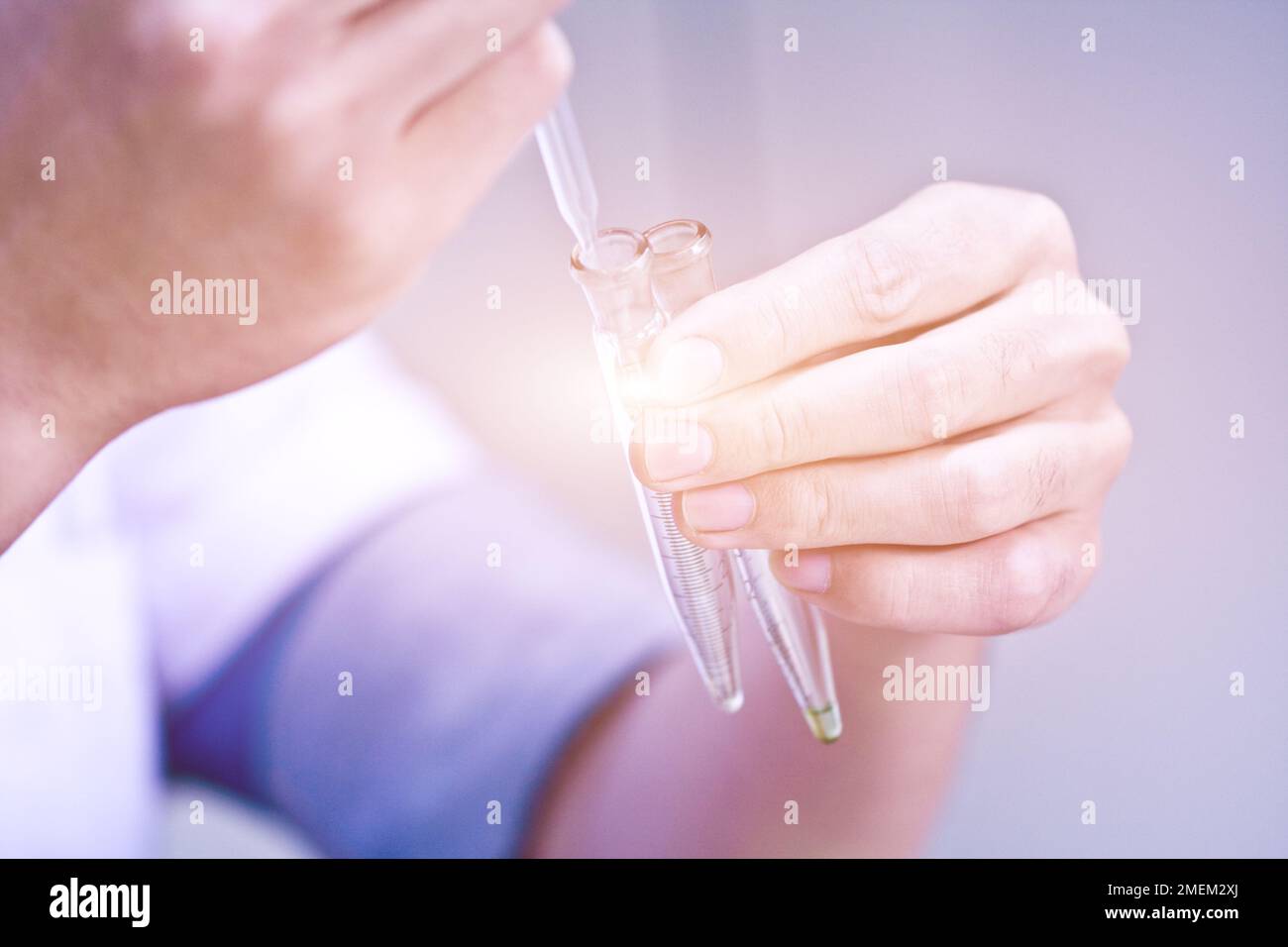 An experiment with a test tube in a laboratory Stock Photo - Alamy